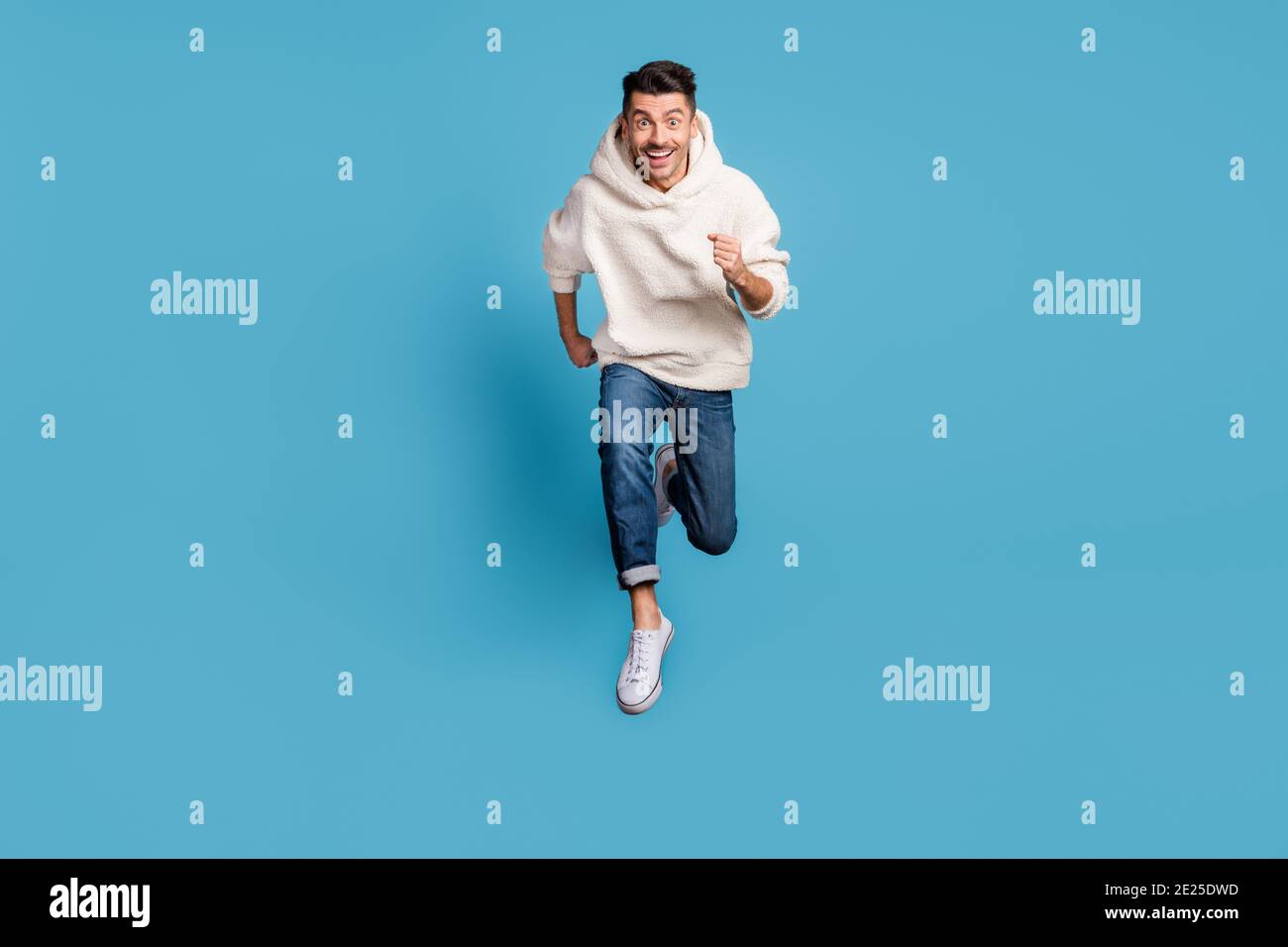Full size photo of young happy cheerful positive good mood man jumping ...