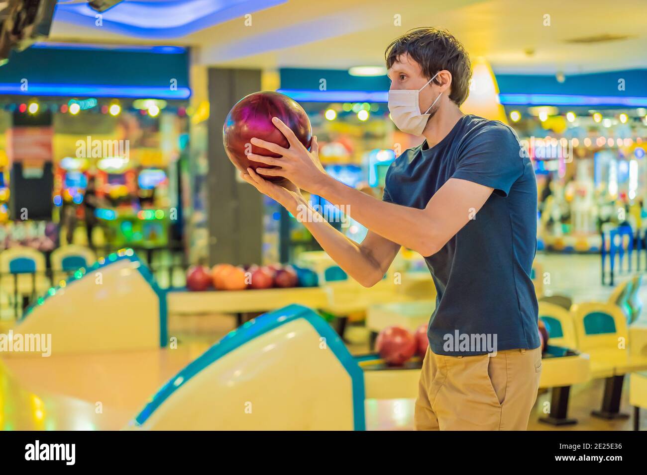 Man playing bowling with medical masks during COVID-19 coronavirus in ...