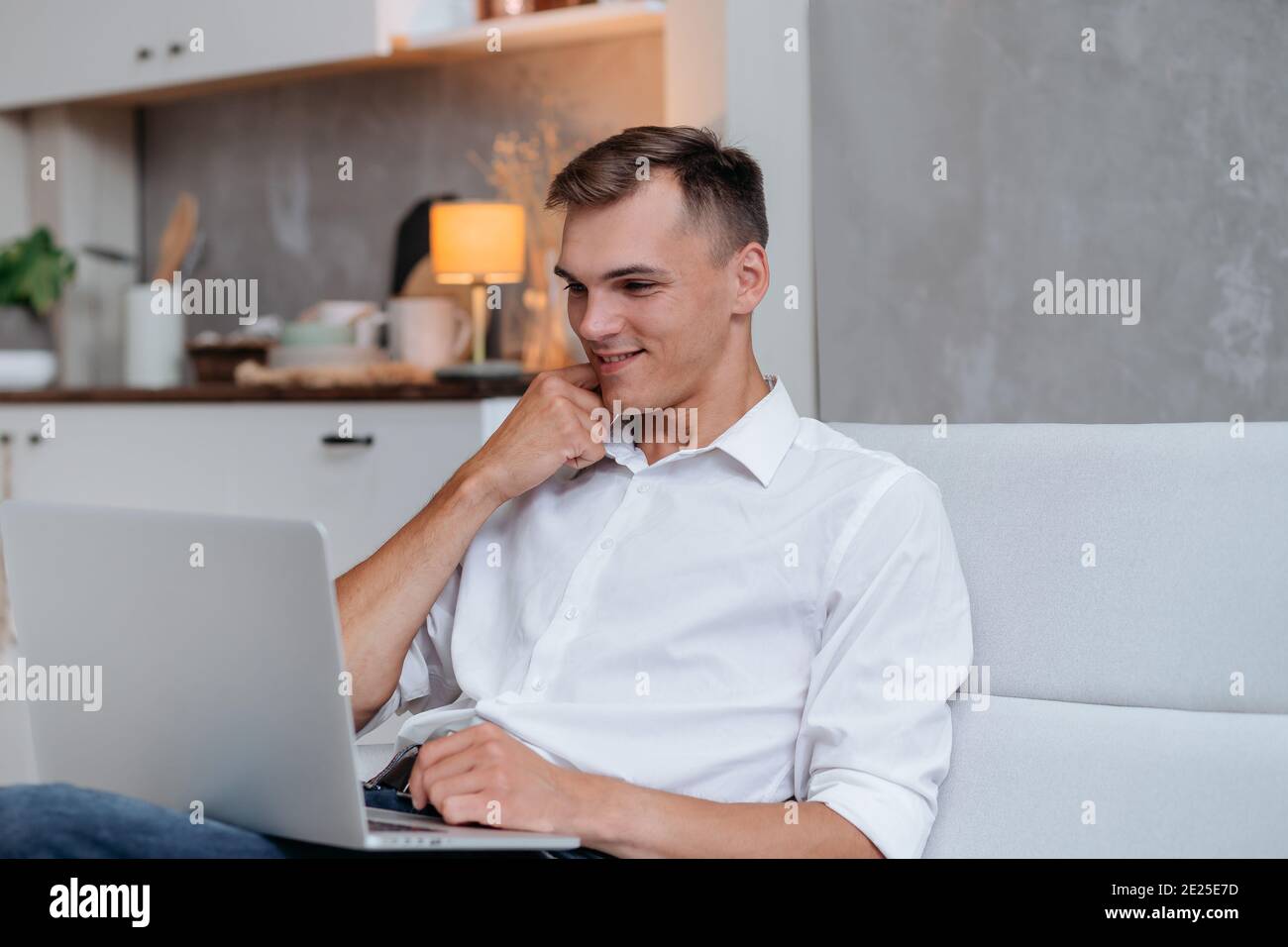 Man illuminated by screen sofa hi-res stock photography and images - Alamy