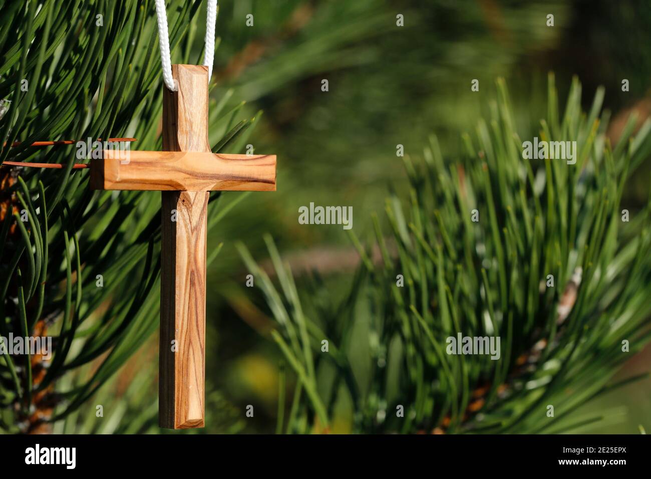 Christian wooden cross on fir tree branches. France Stock Photo - Alamy