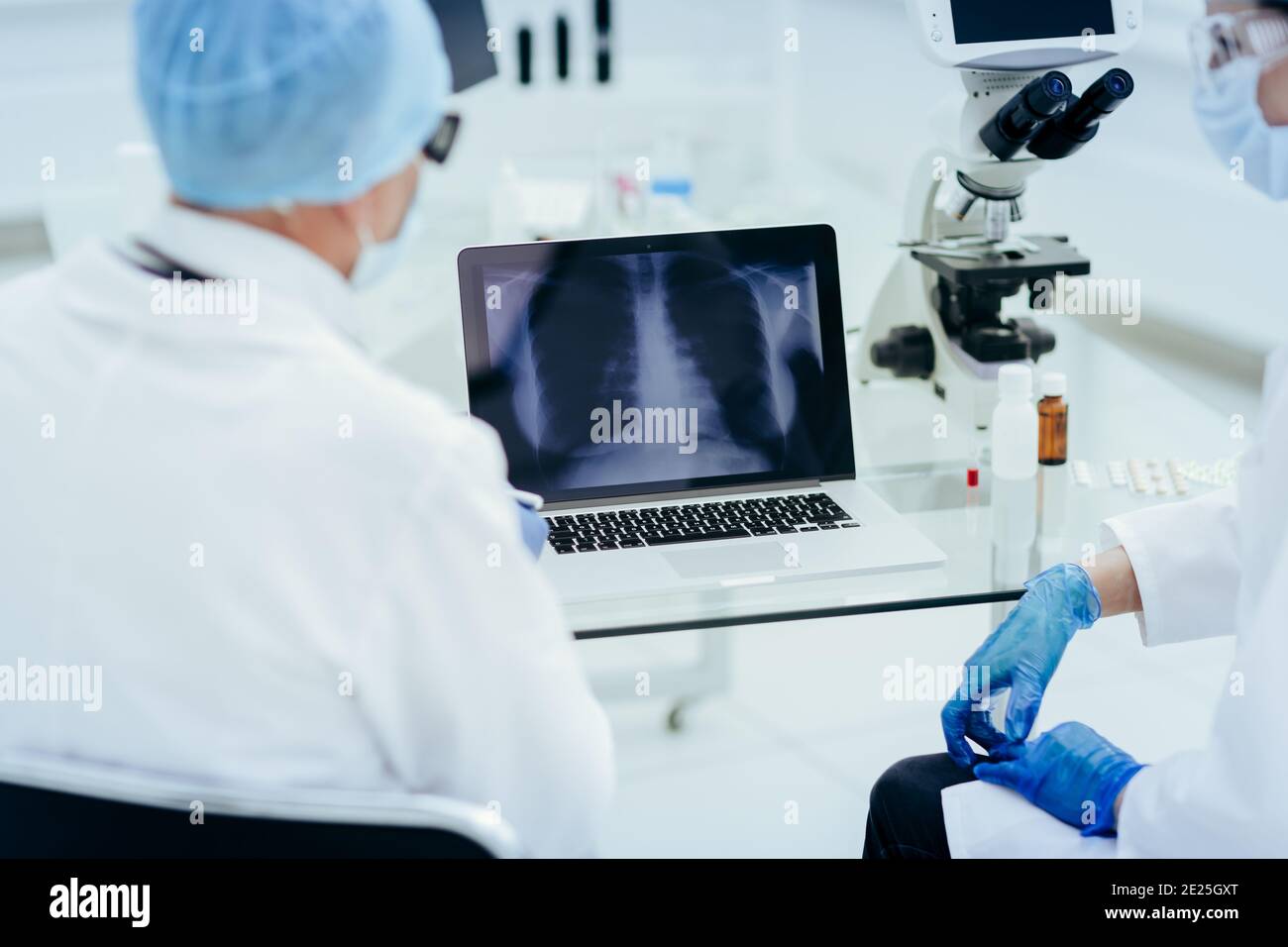 doctors looking at the Chest x-ray scan on screen of laptop Stock Photo ...