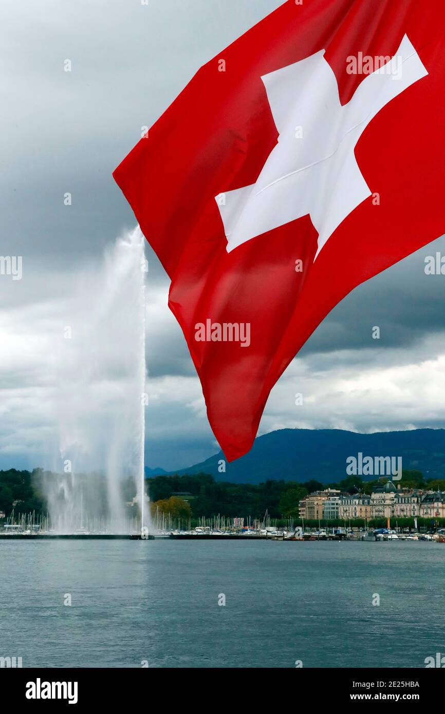 Swiss flag and Jet d'Eau, the world's tallest fountain, on Lake Geneva ...