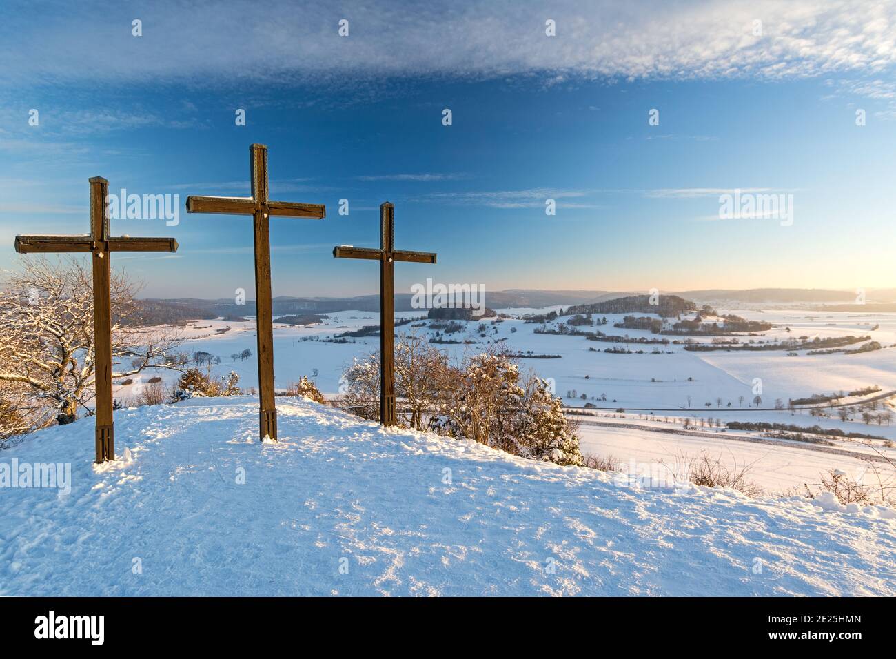 Three summit crosses on a mountain peak in a beautiful winter landscape ...