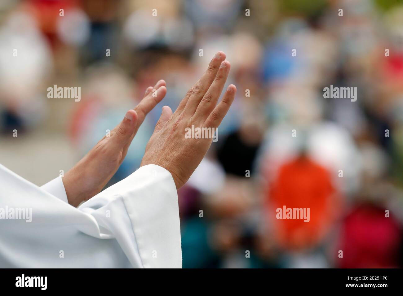 Praying hands priest hi-res stock photography and images - Alamy