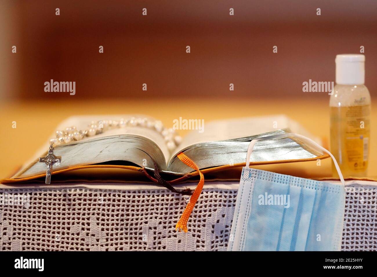 Catholic church. Bible, surgical mask, hydro-alcoholic gel. Covid-19 ...