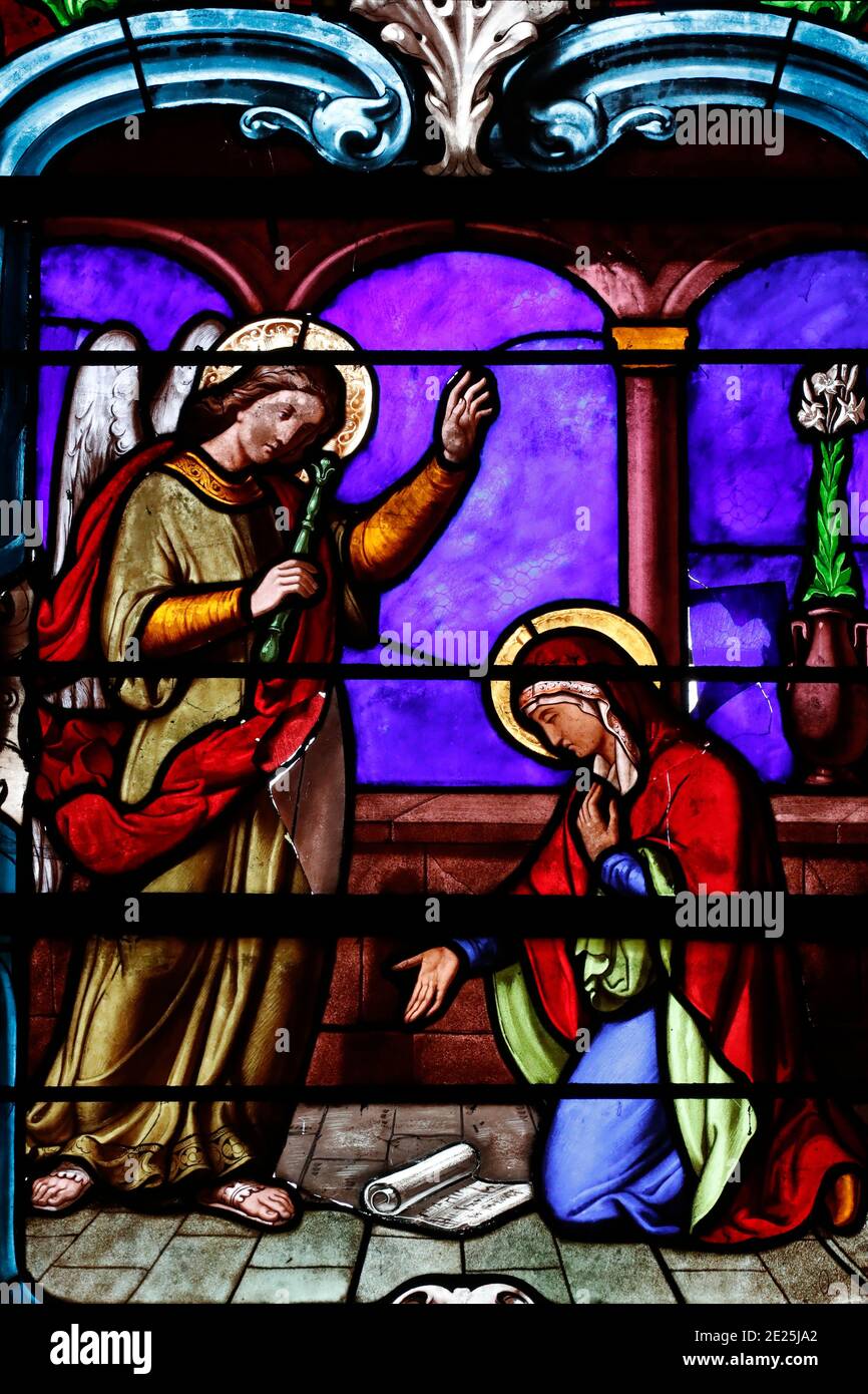 Stained glass window. The Annunciation is the announcement by the angel Gabriel to the Virgin ...