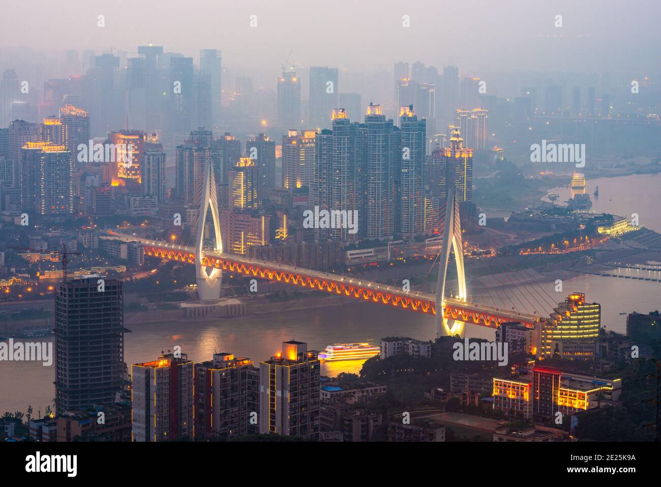 Chongqing, China downtown city skyline over the Yangtze River at sunset ...
