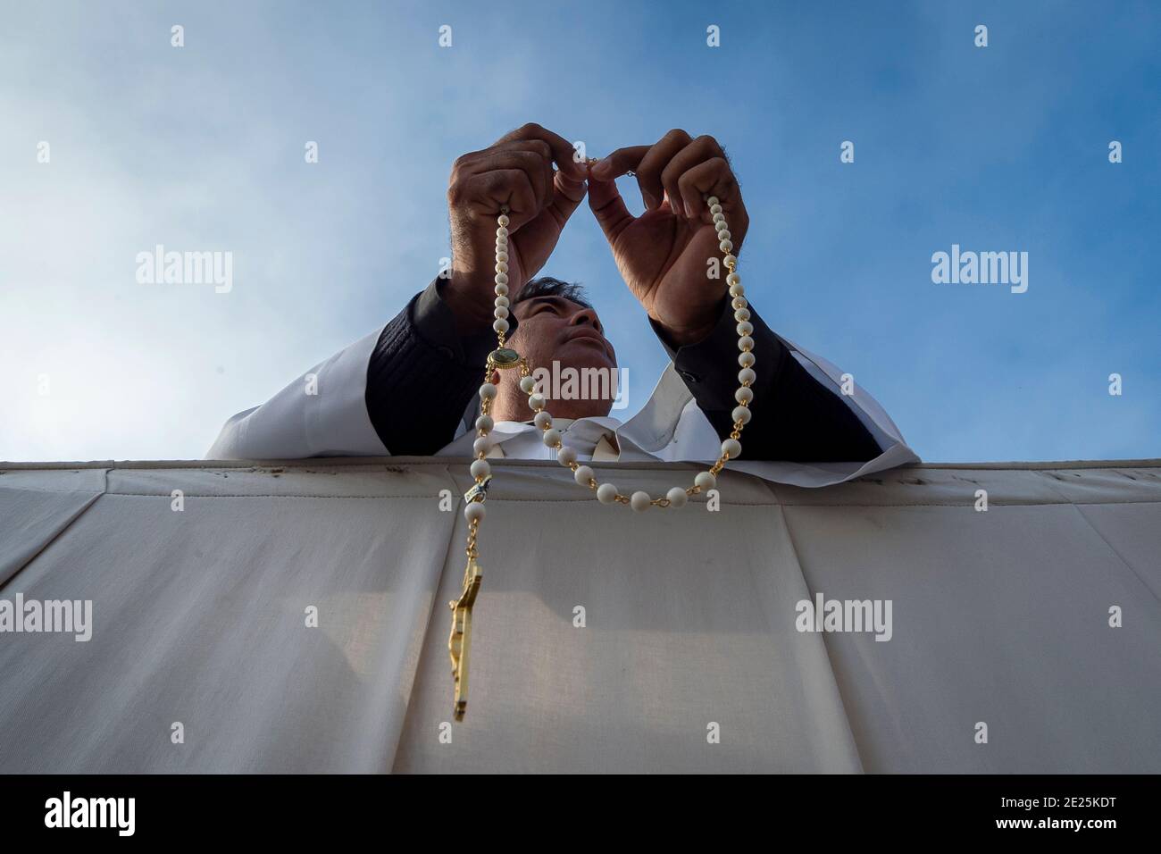 The rosary priest hi-res stock photography and images - Alamy