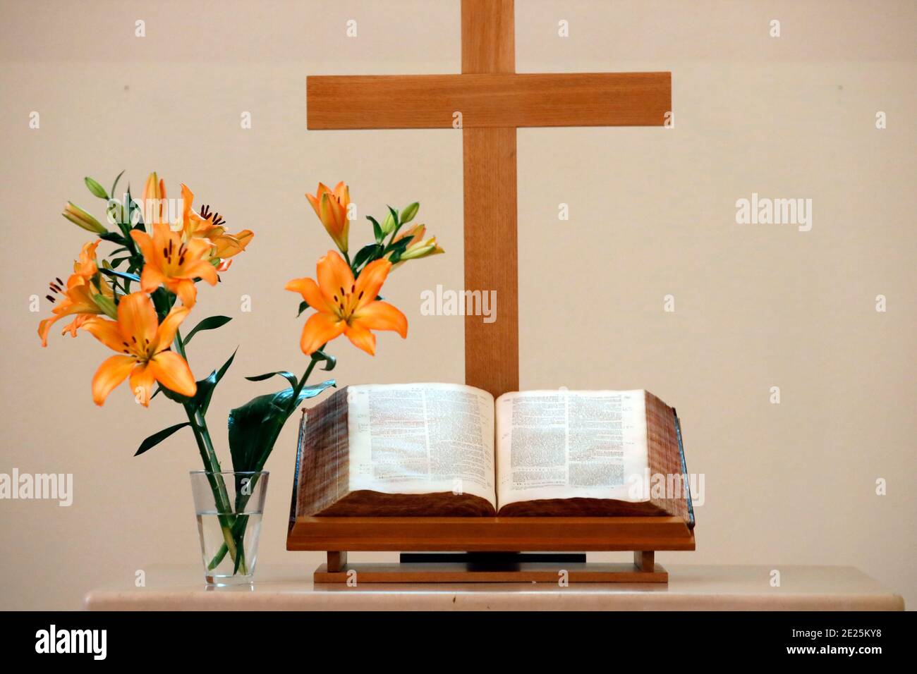 Protestant church. Open old bible, flowers and wooden cross Stock Photo ...