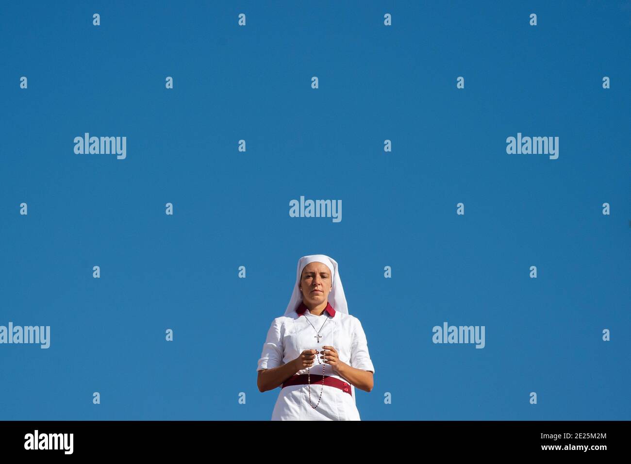 Nun praying with rosary hi-res stock photography and images - Alamy