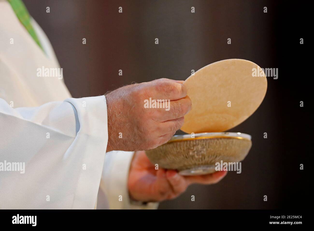 Catholic church. Sunday mass. Priest at eucharistic celebration. France ...