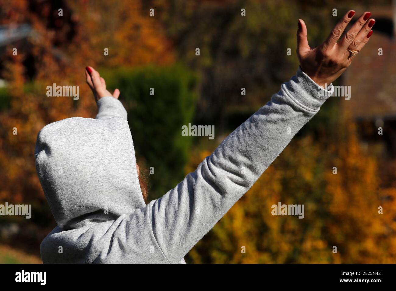 Christian woman praying in the forest. Autumn. France Stock Photo - Alamy