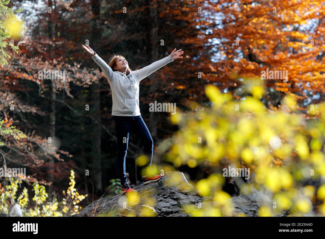 Christian woman praying in the forest. Autumn. France Stock Photo - Alamy
