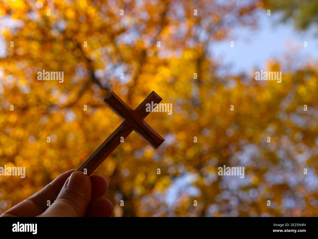 Christian wooden cross in hand. Faith and spirituality. France Stock ...