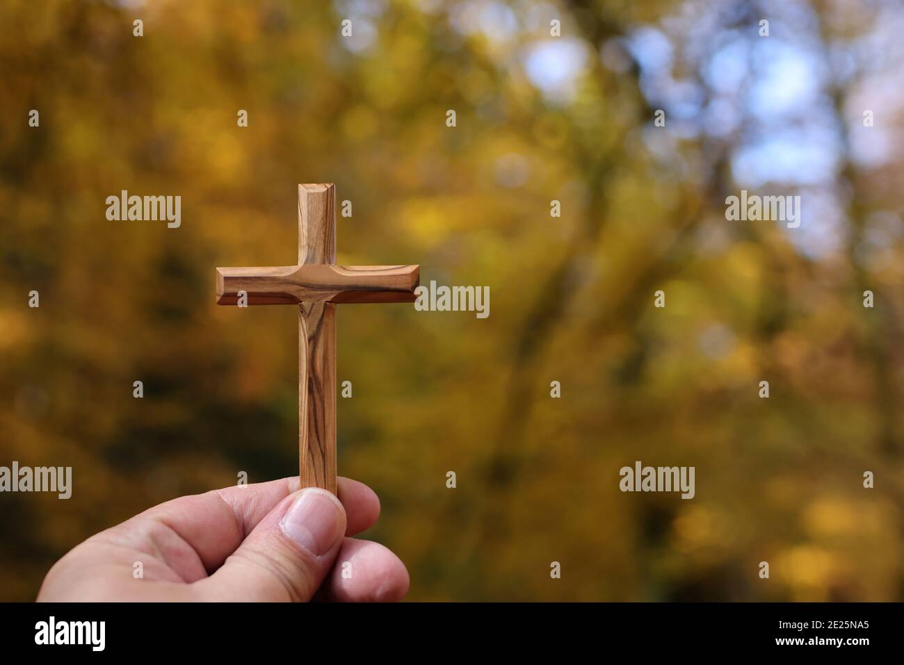 Christian wooden cross in hand. Faith and spirituality. France Stock ...
