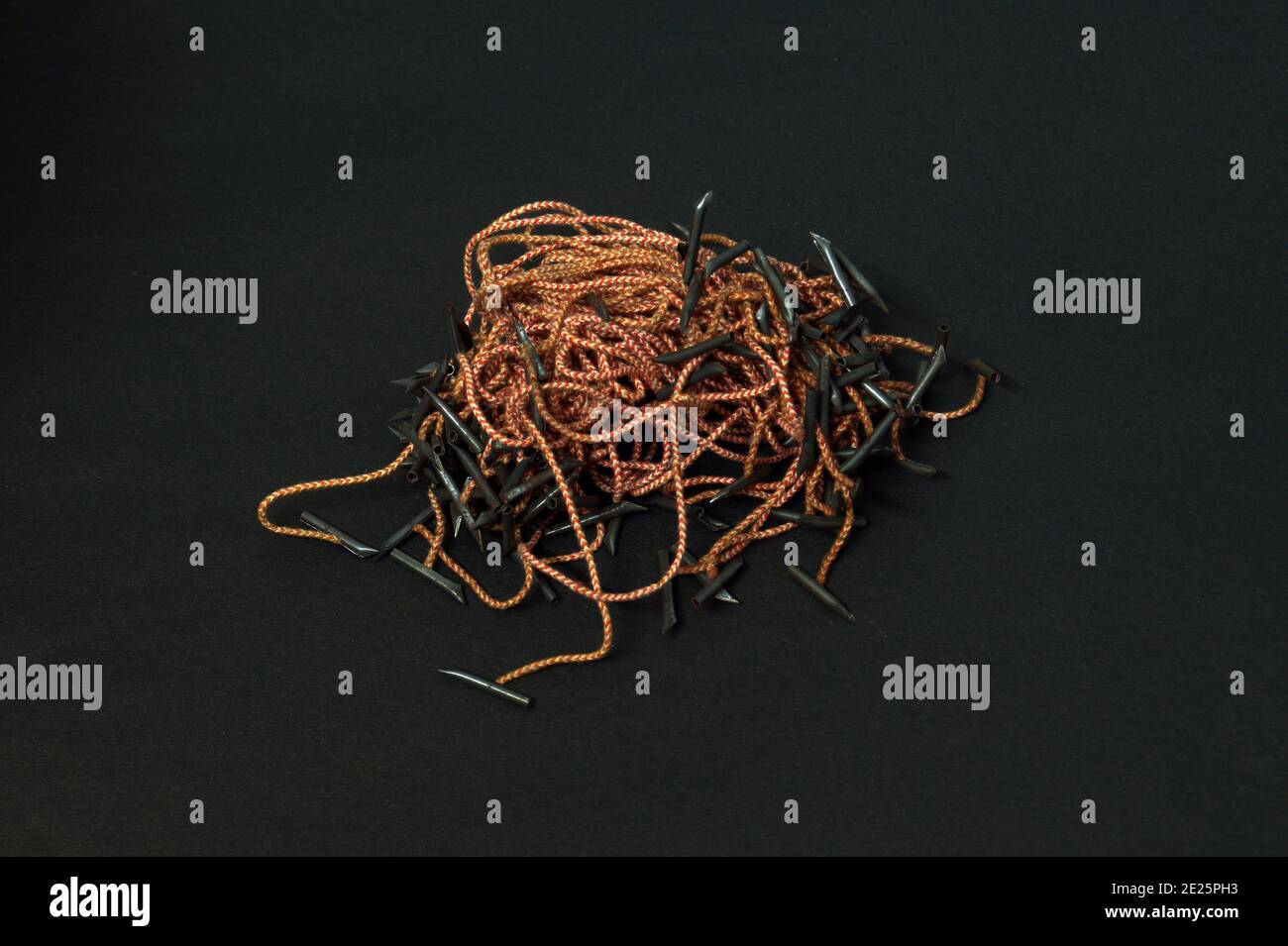 Paper Tag threads on a black background Stock Photo - Alamy