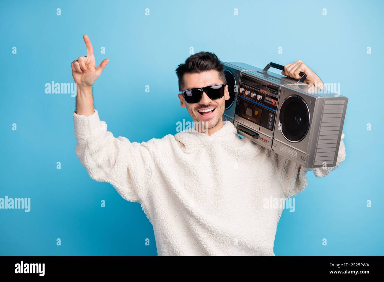 Photo portrait of hip guy with stubble pointing finger up dancing ...