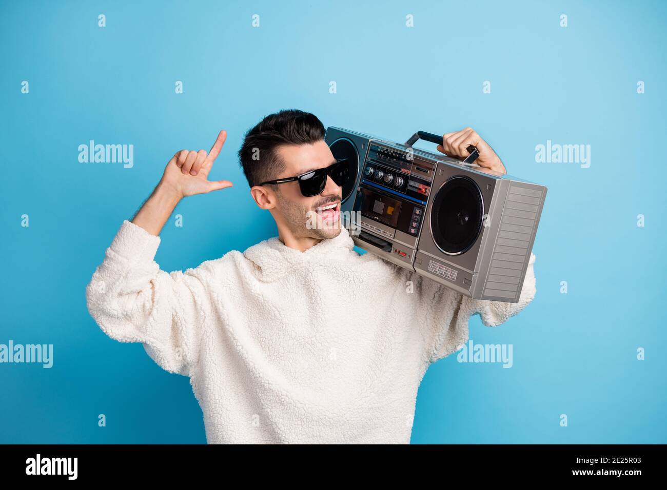 Photo portrait of chill man with stubble carrying boombox on shoulder ...