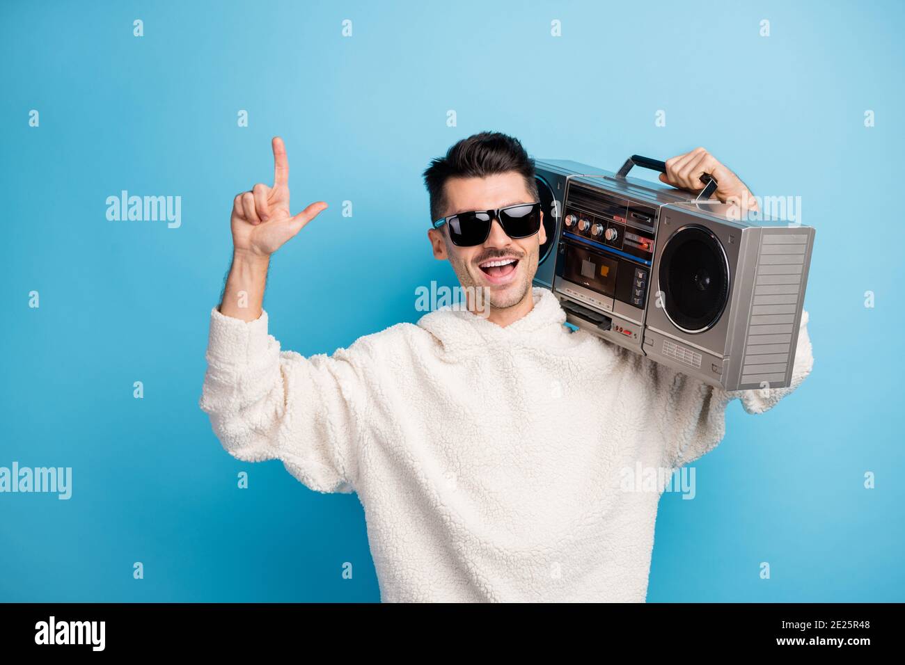 Photo portrait of cool dude with stubble pointing finger up holding ...