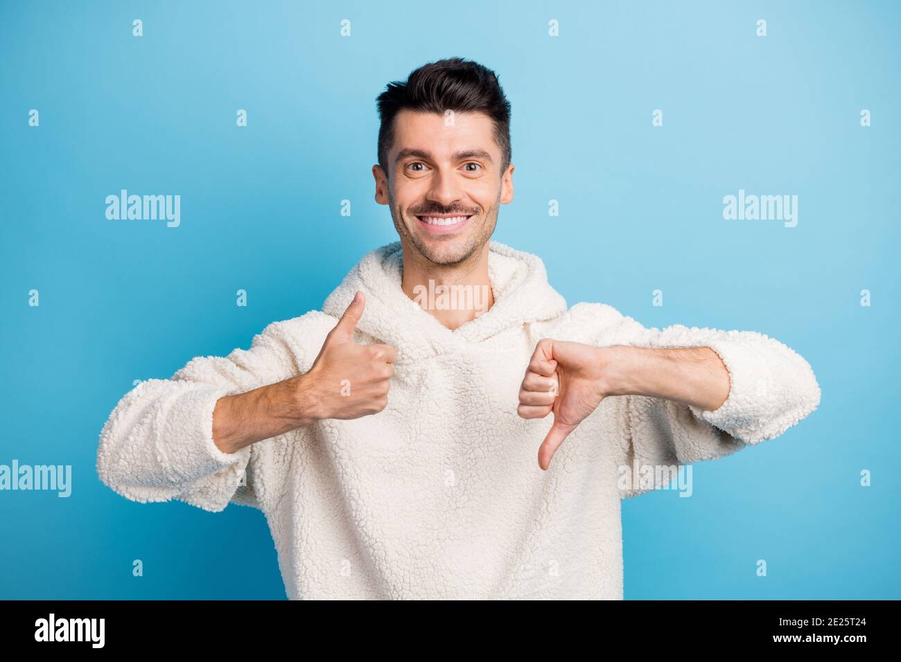 Photo portrait concept of smiling man with moustache pointing thumbs up ...