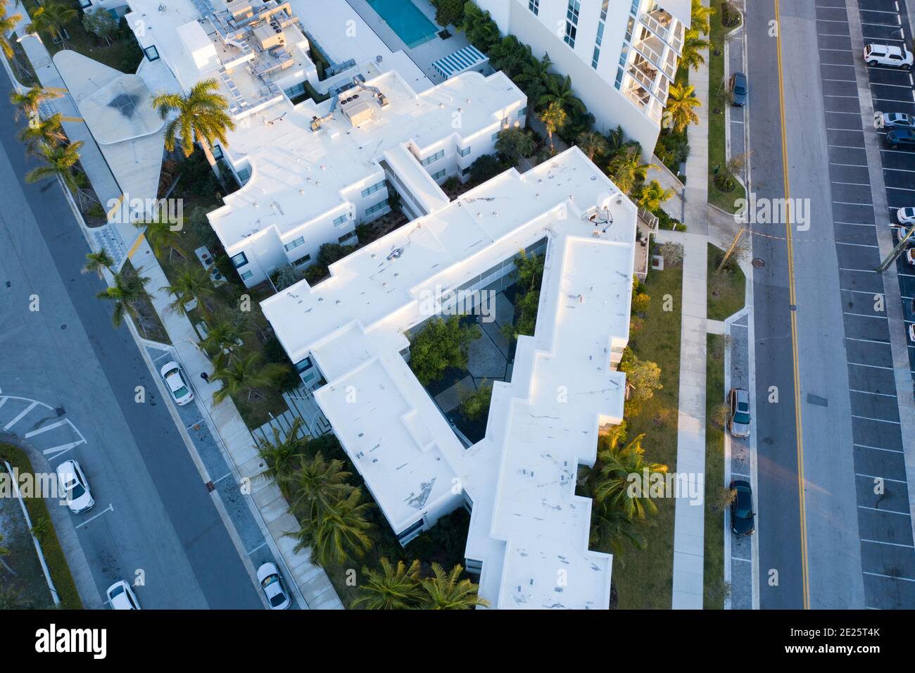 Aerial photo of a low rise building with palm trees South Florida style ...
