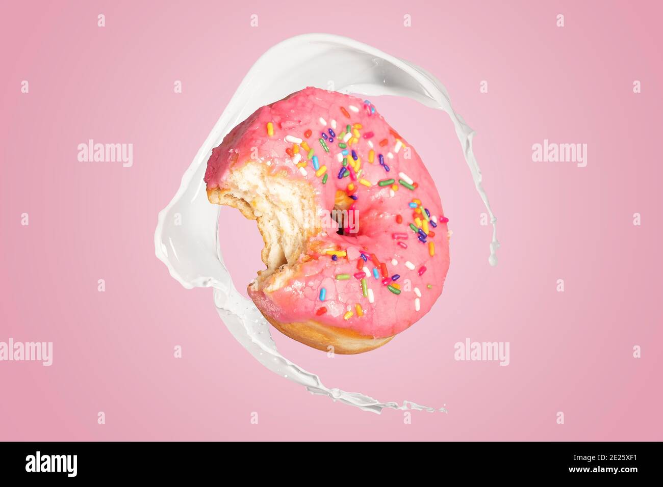 One donut doughnut with a bit taken out of it falling and splashing ...