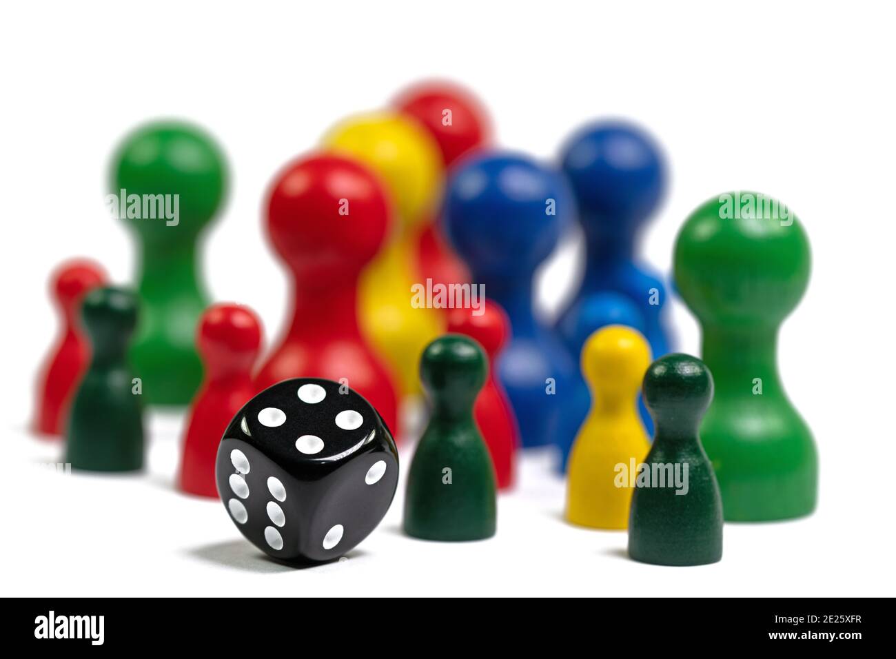 Colorful game figures and dice against a white background Stock Photo ...