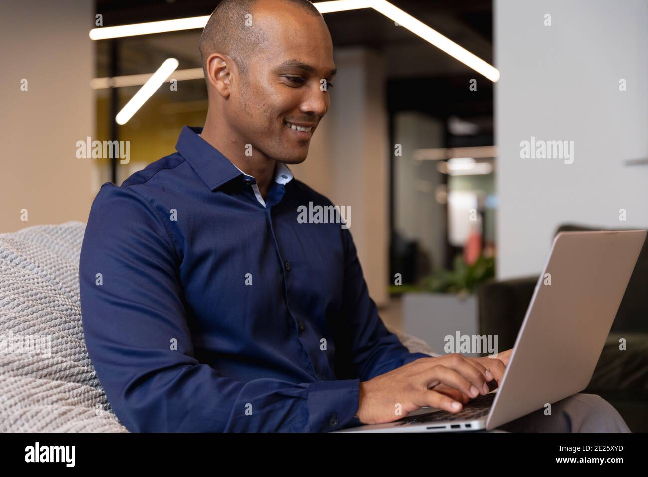 Modern businessman using laptop sitting hi-res stock photography and ...