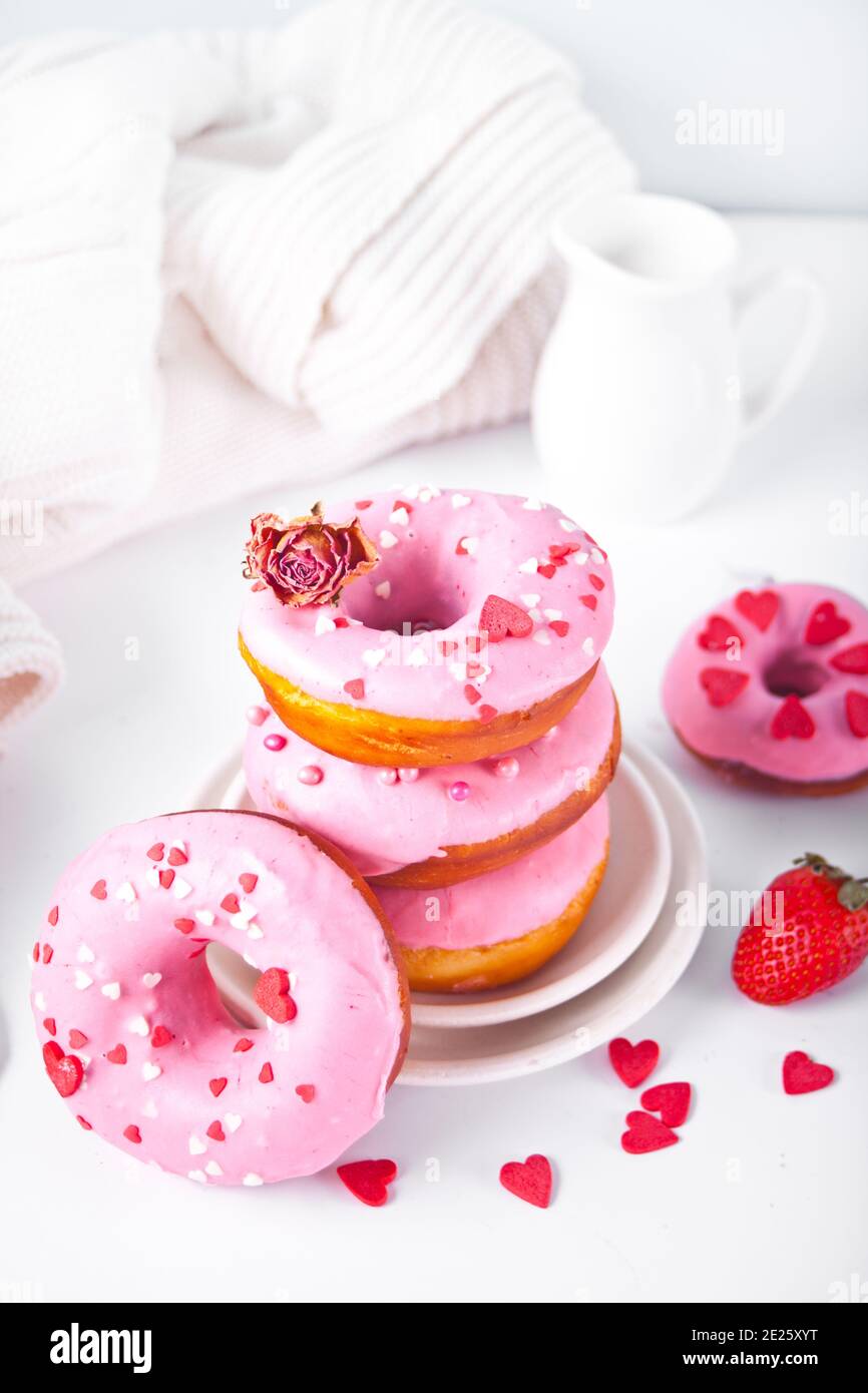 Stack doughnuts pink icing hi-res stock photography and images - Alamy