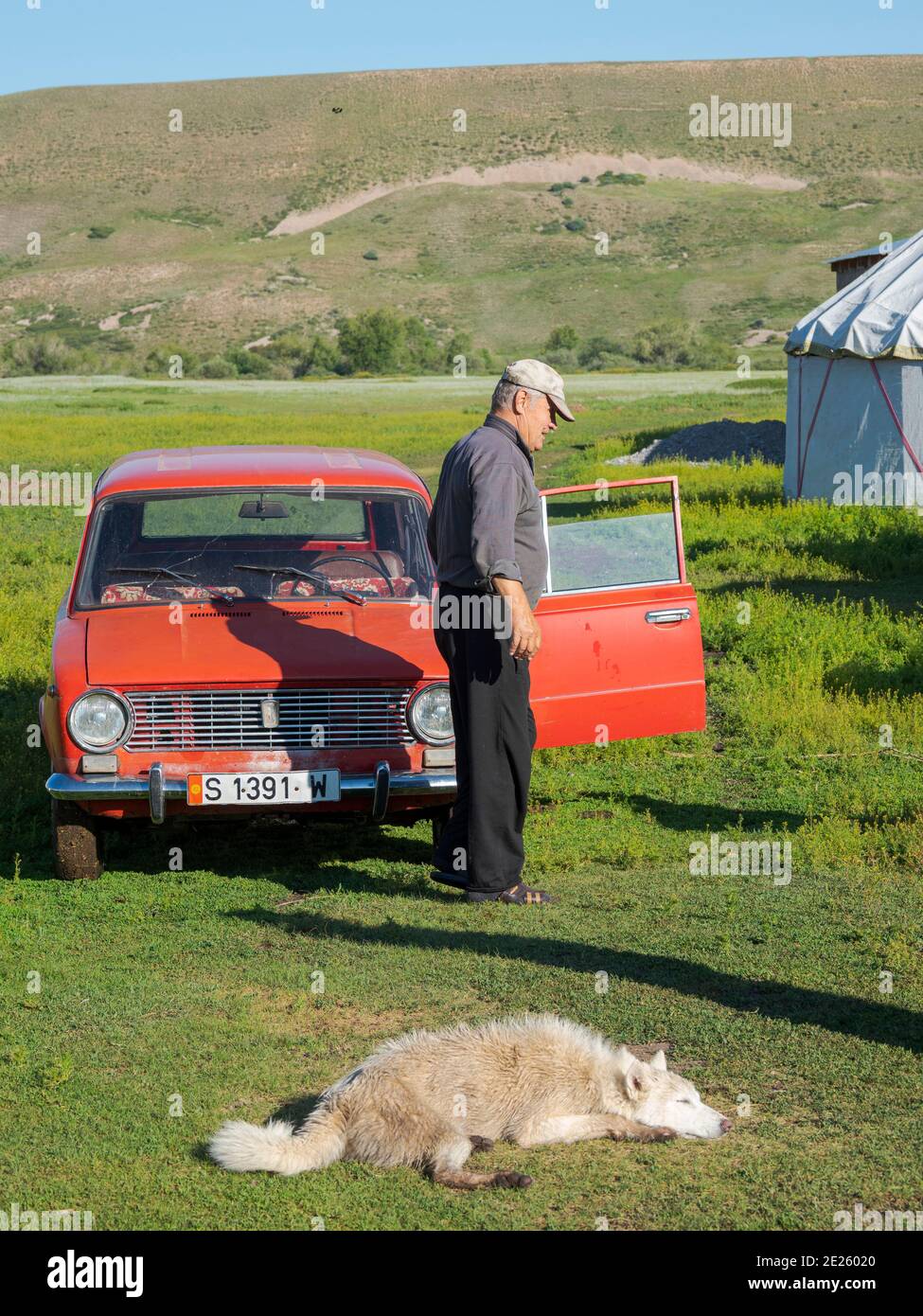 Greeting a visitor. A typical farm on the Suusamyr plain, a high valley ...