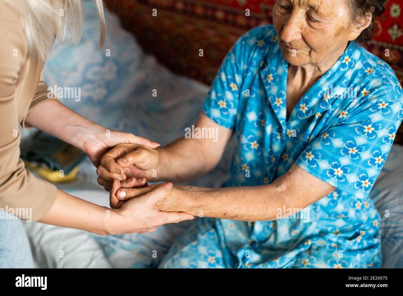 Senior woman with her home caregiver Stock Photo - Alamy