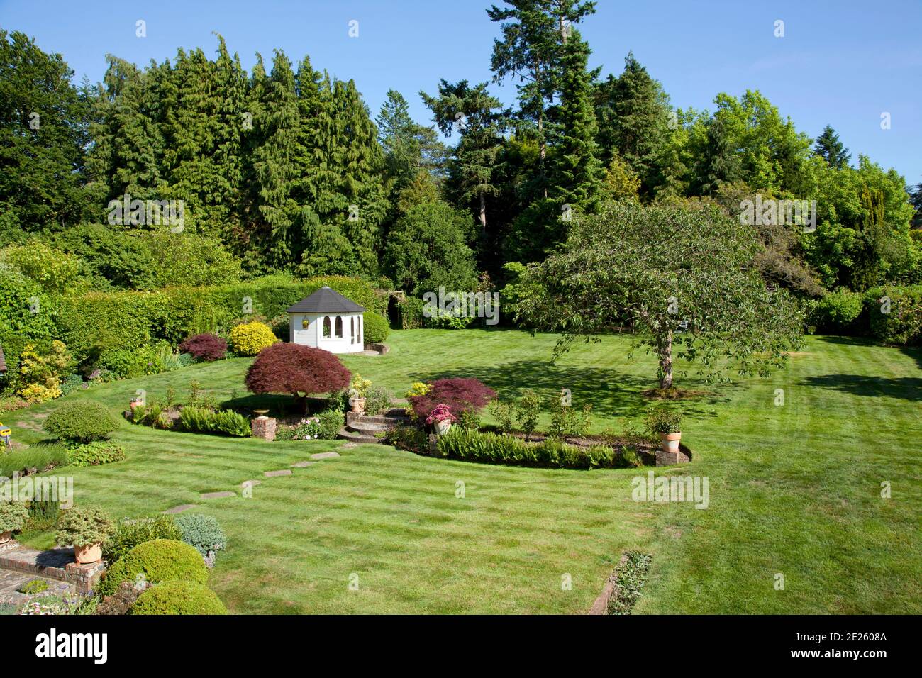 Overview of garden with summer house, lawn and mature trees Stock Photo ...