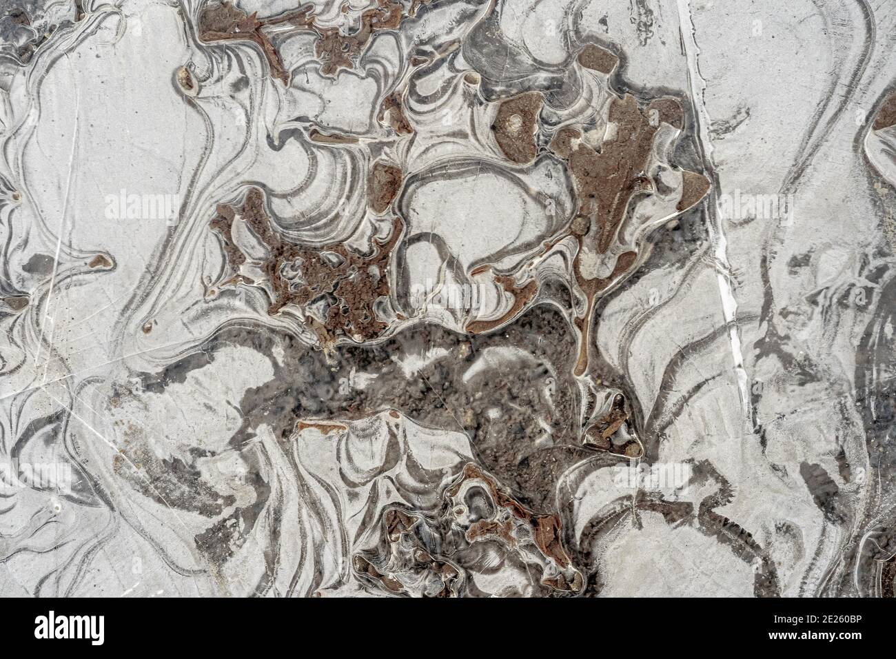 frozen ice on sidewalk in New York with design Stock Photo - Alamy