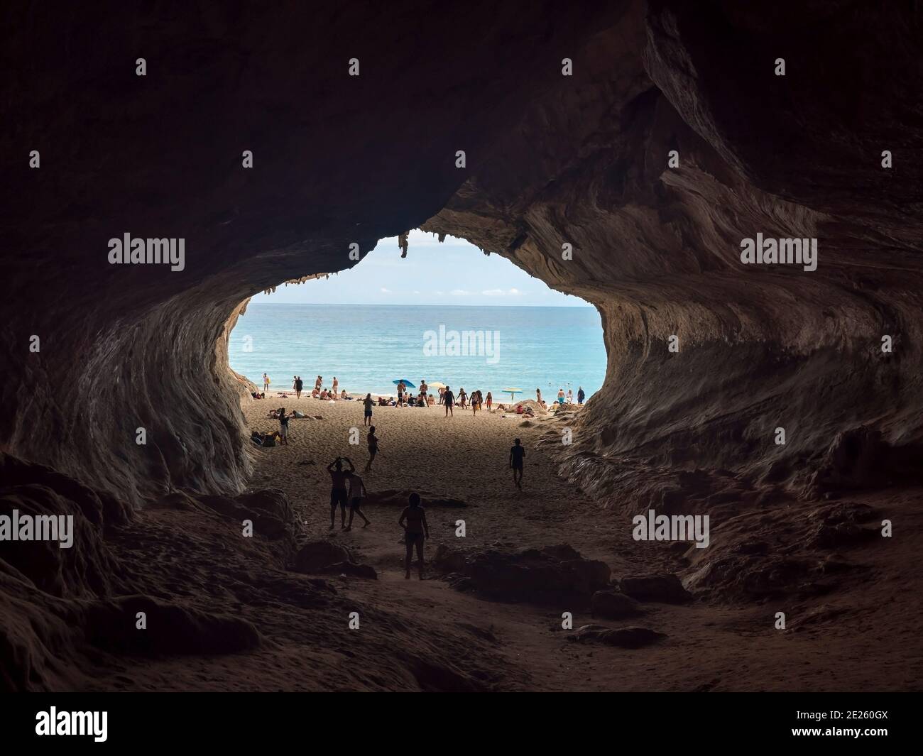 View from inside of limestone sea cave at Cala Luna beach, Sardinia ...