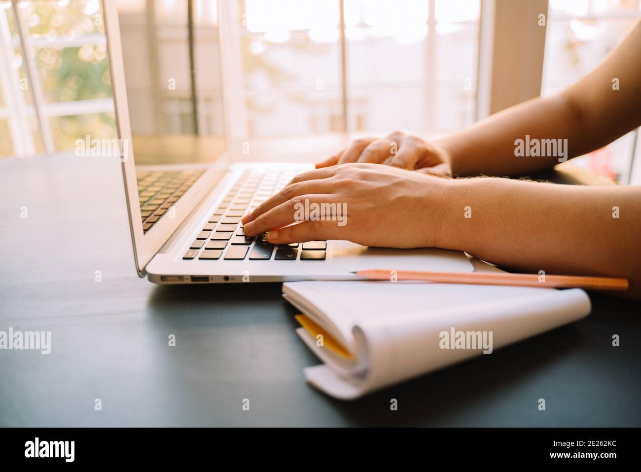 open notebook and laptop. person teenager young woman taking note in ...