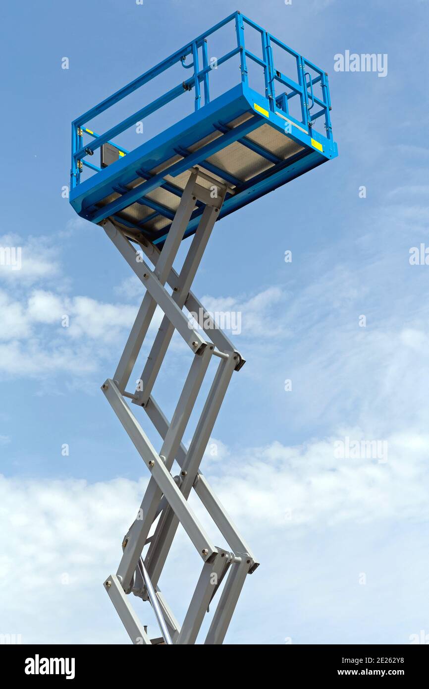 Elevated Work Platform Scissor Lift at Blue Sky Stock Photo - Alamy