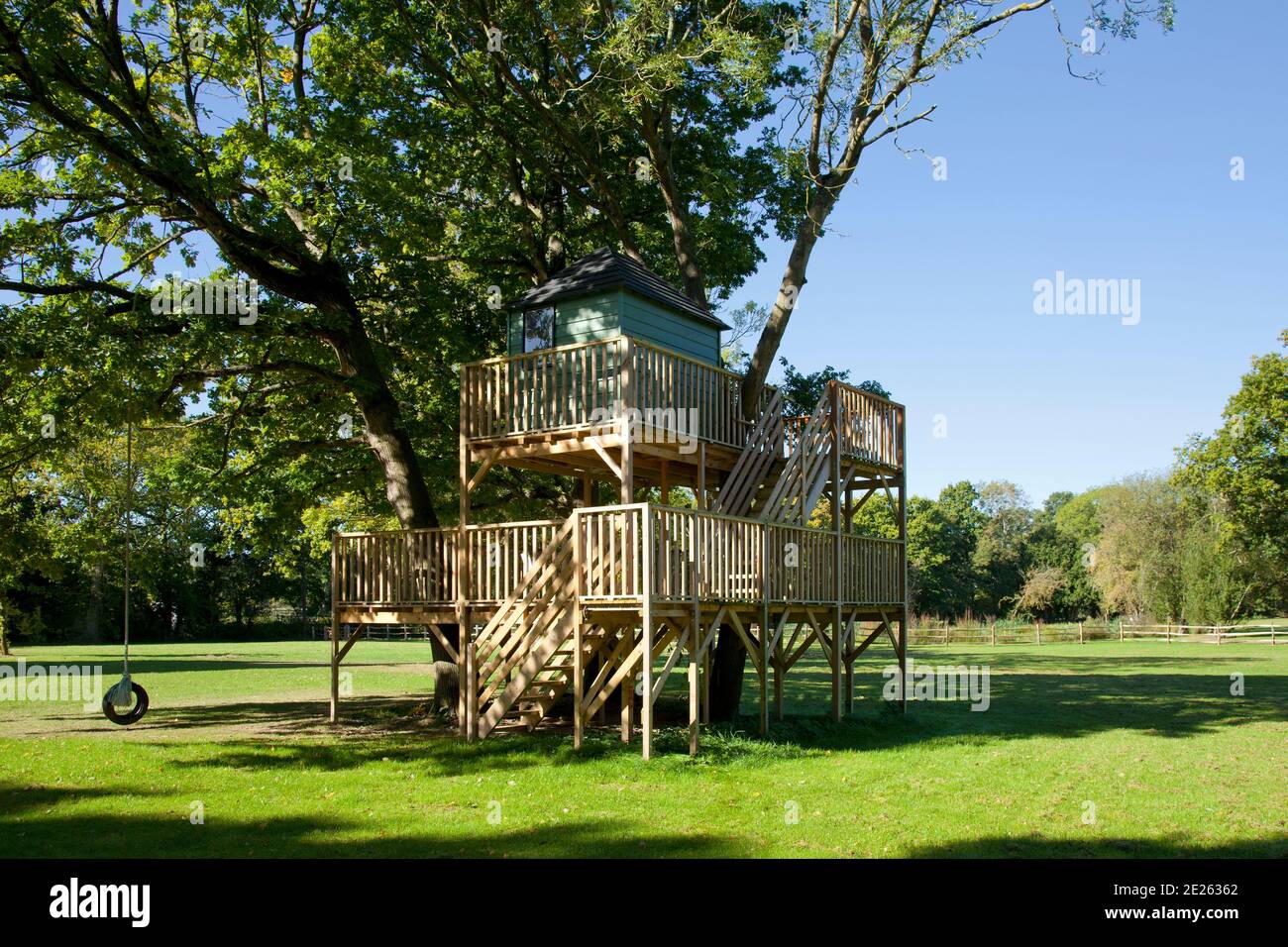 Two-storey tree house in garden Stock Photo - Alamy