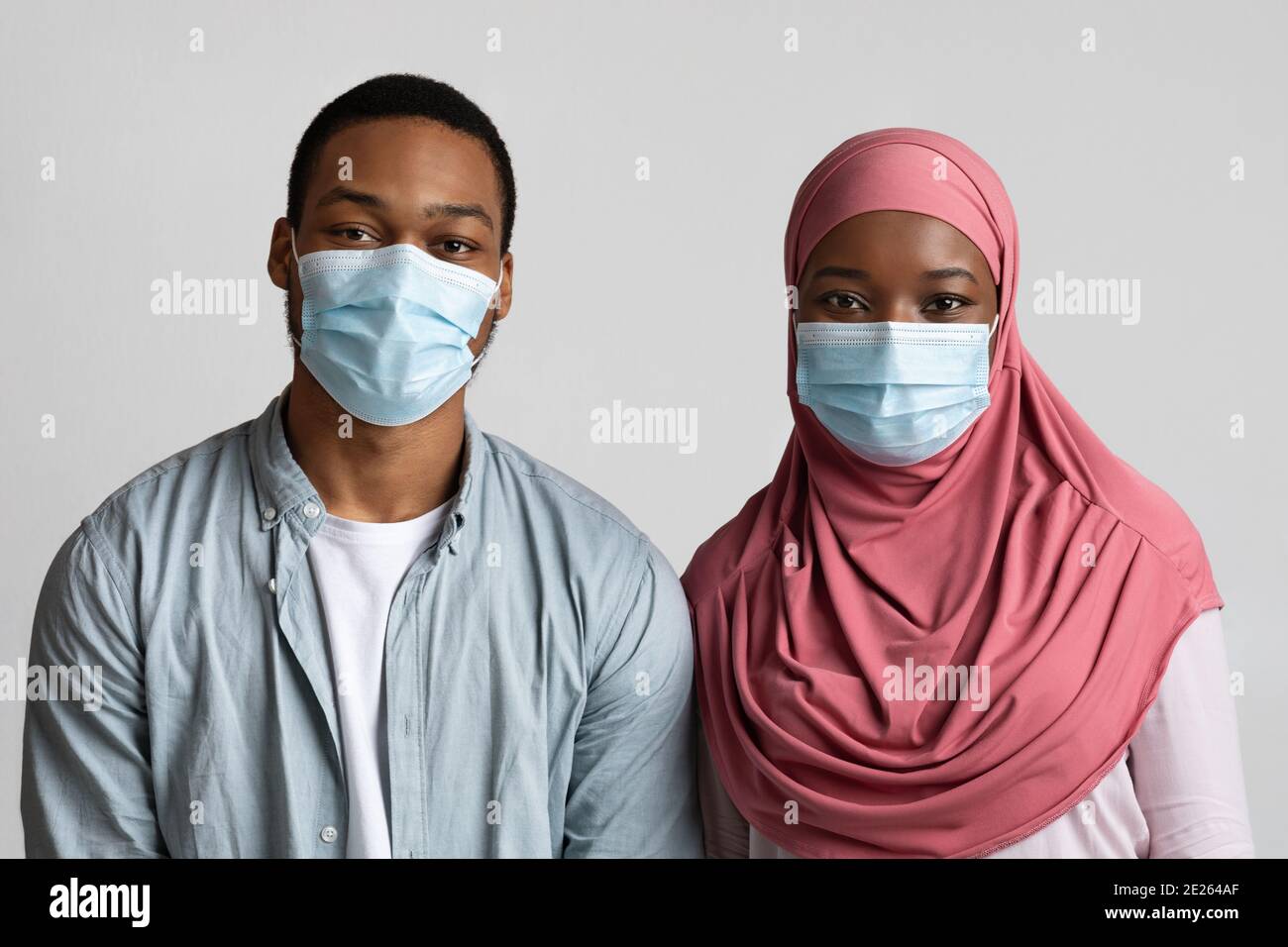 African american muslim couple wearing protective medical masks for ...