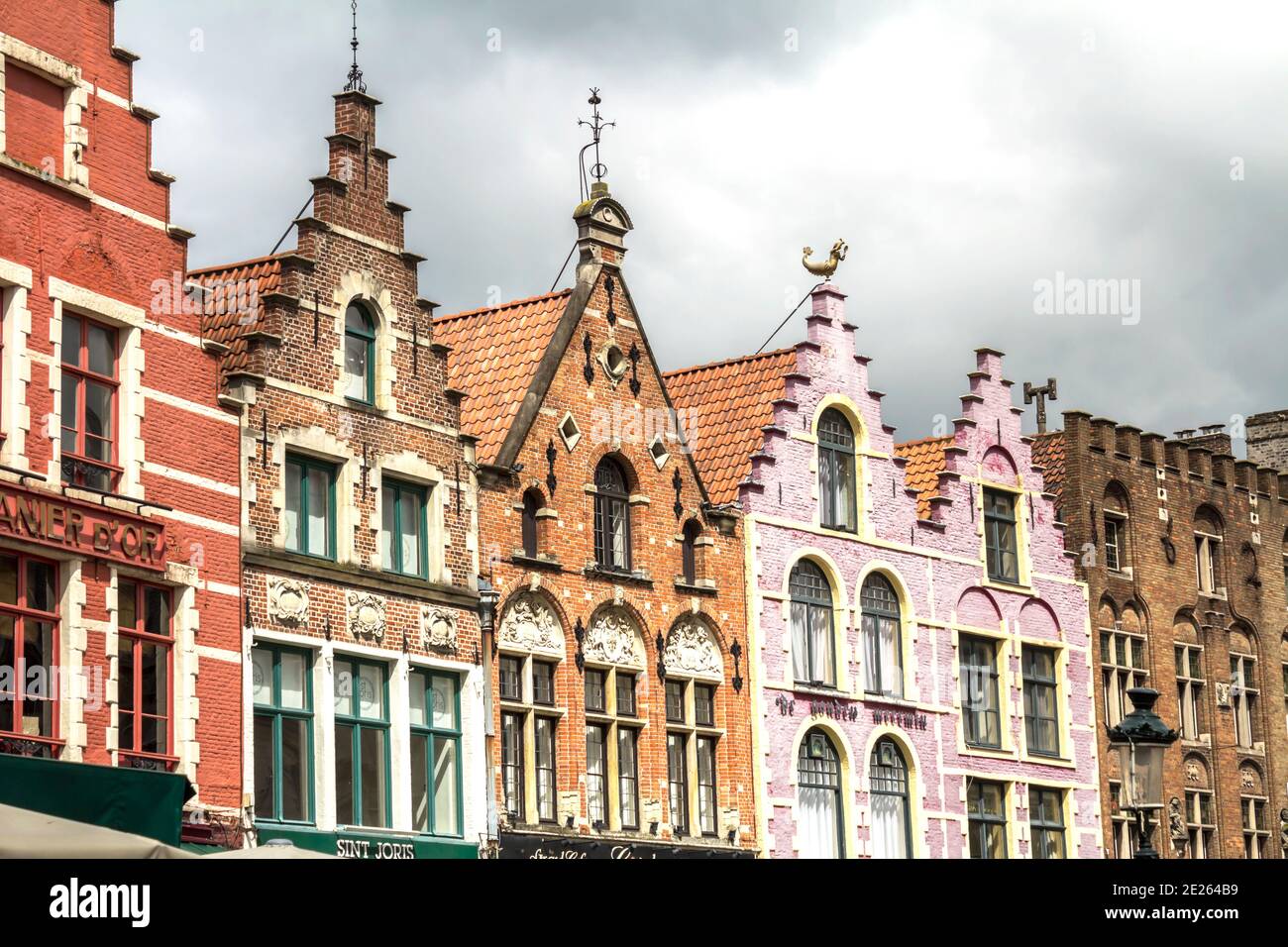 Famous old colorful buildings at Market square in Bruges, Belgium ...
