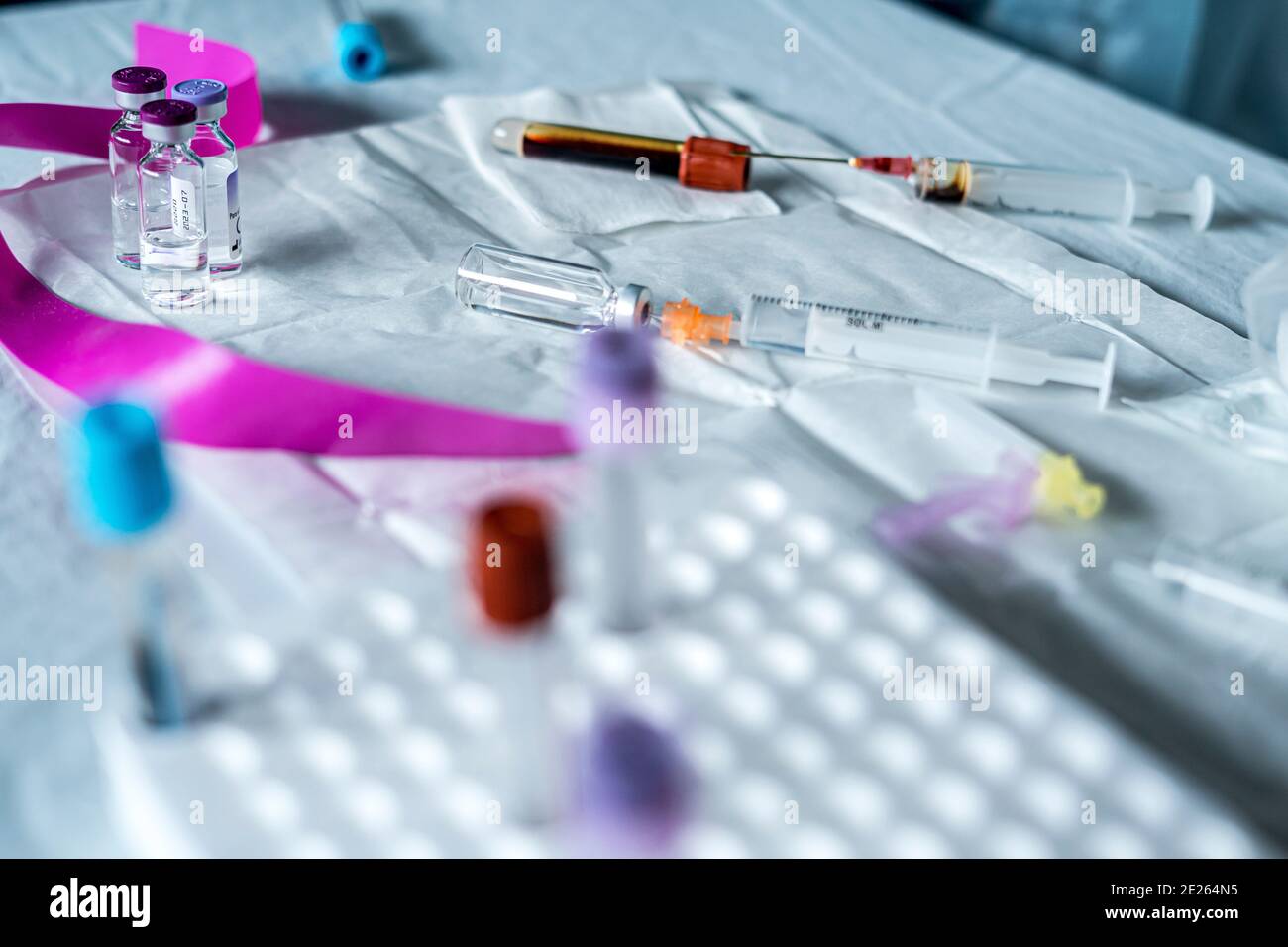 Doctor analysing syringe sample hi-res stock photography and images - Alamy