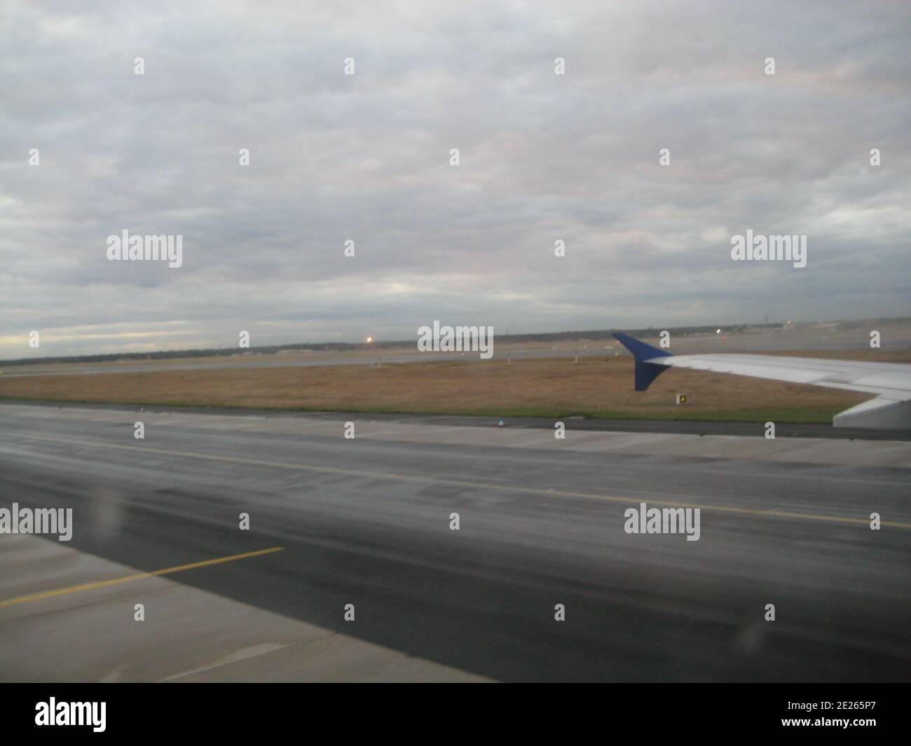 view over a plane wing on the tarmac Stock Photo - Alamy