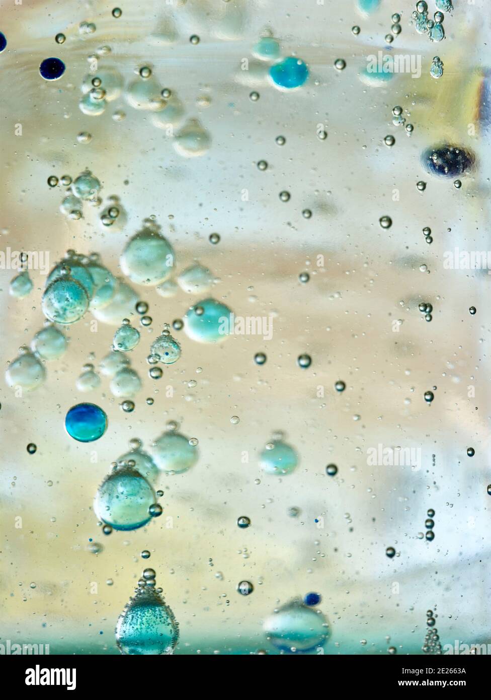 Abstract of colourful bubbles rising through liquid, background ...