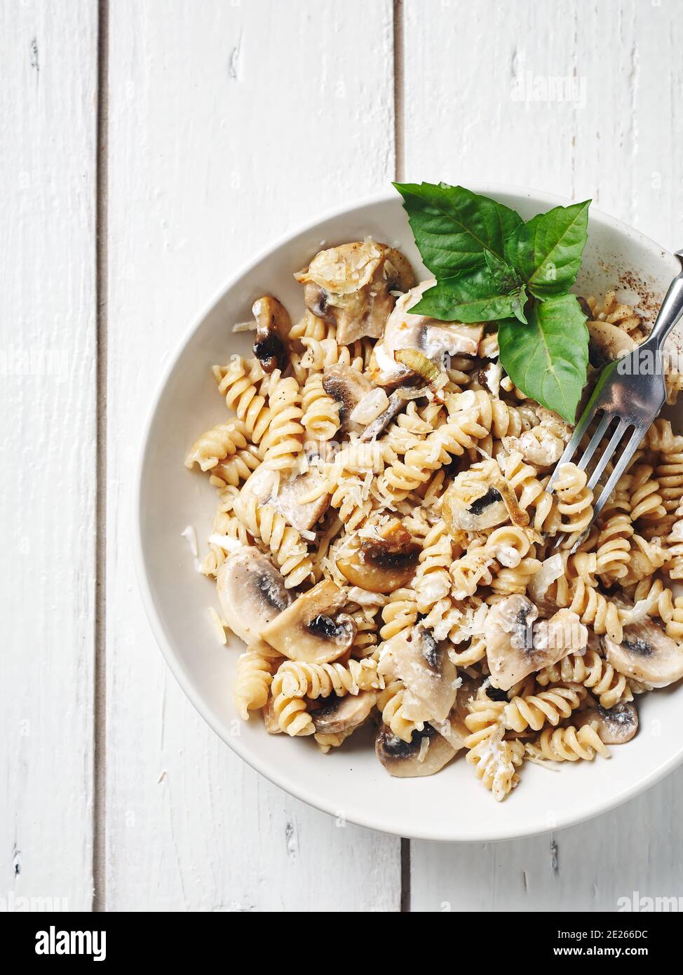 Fusilli pasta with mushrooms and cheese Stock Photo - Alamy