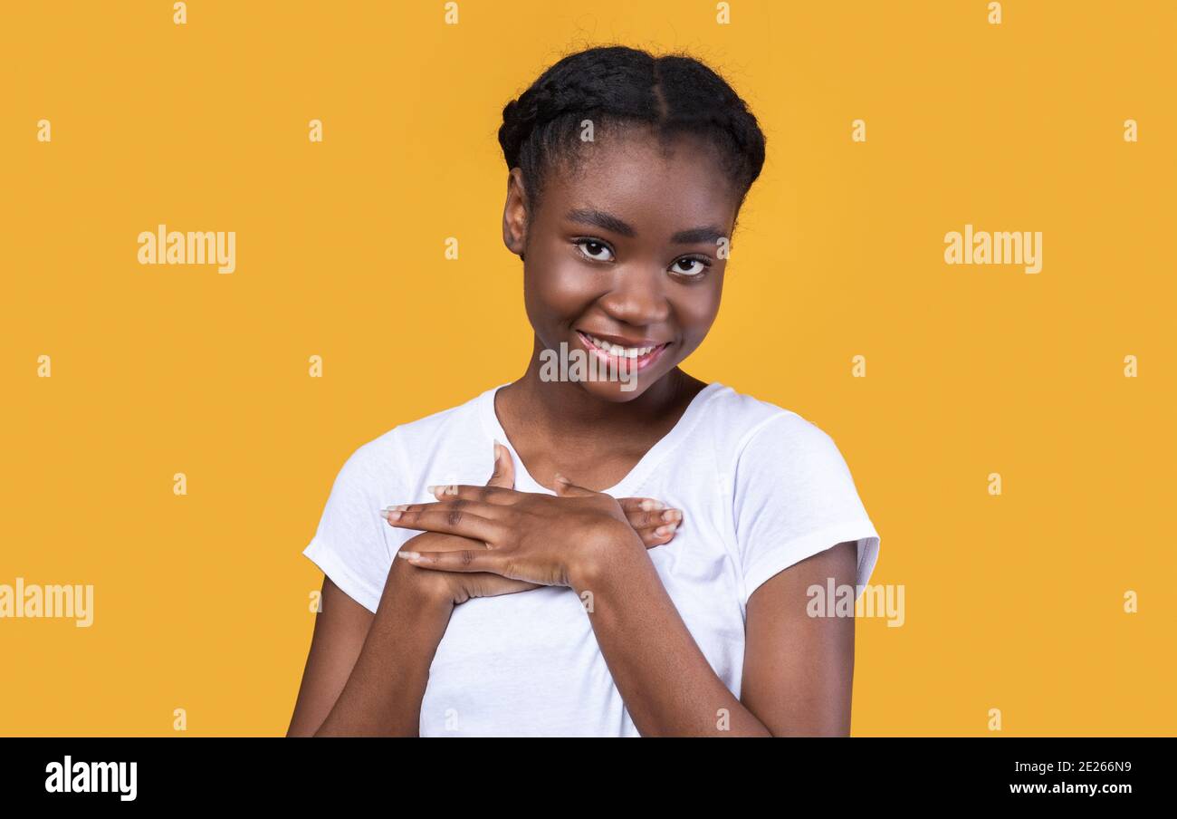 Woman hands over her chest hi-res stock photography and images - Alamy