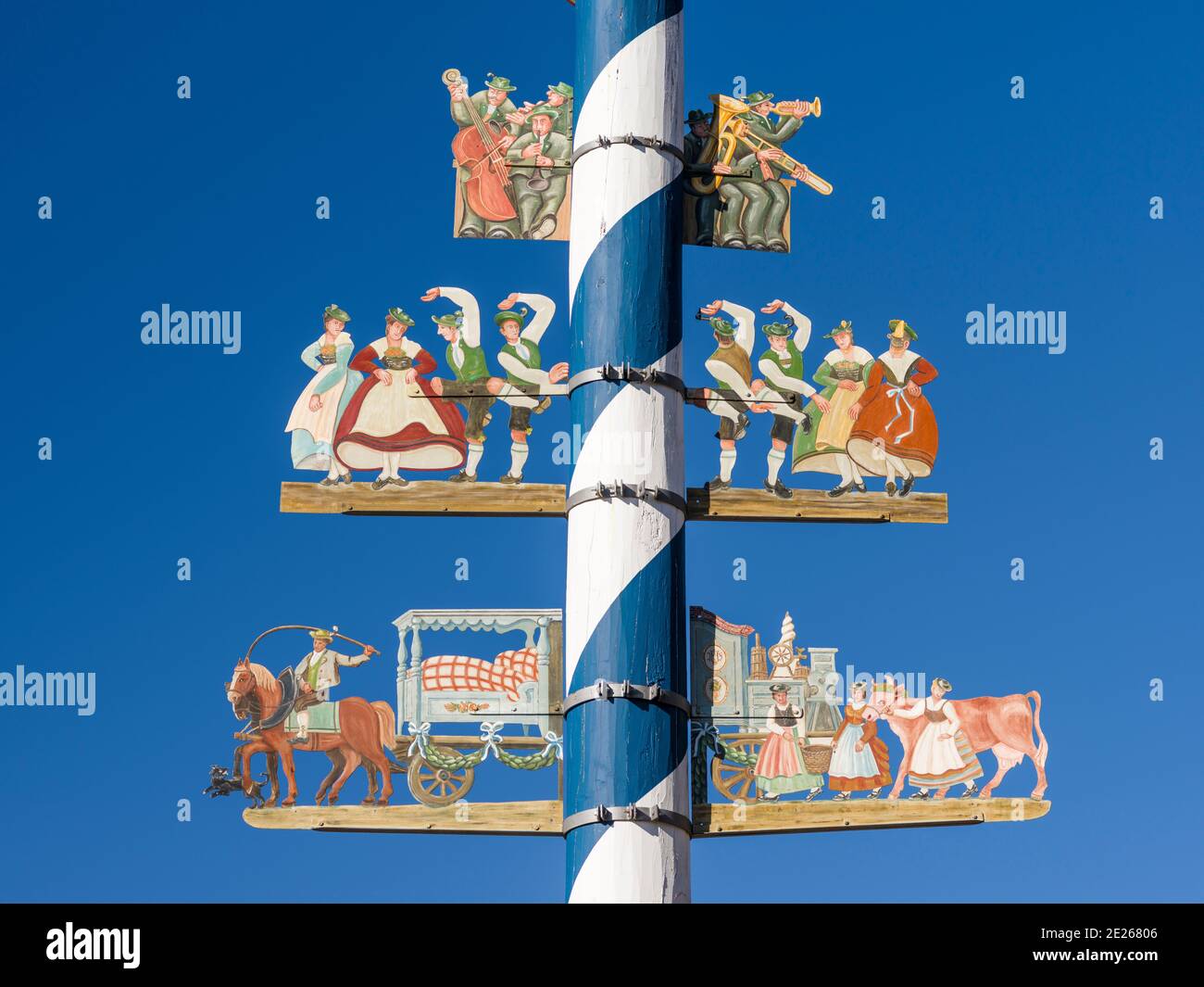 Traditional bavarian maypole (Maibaum). Village Schliersee in the ...