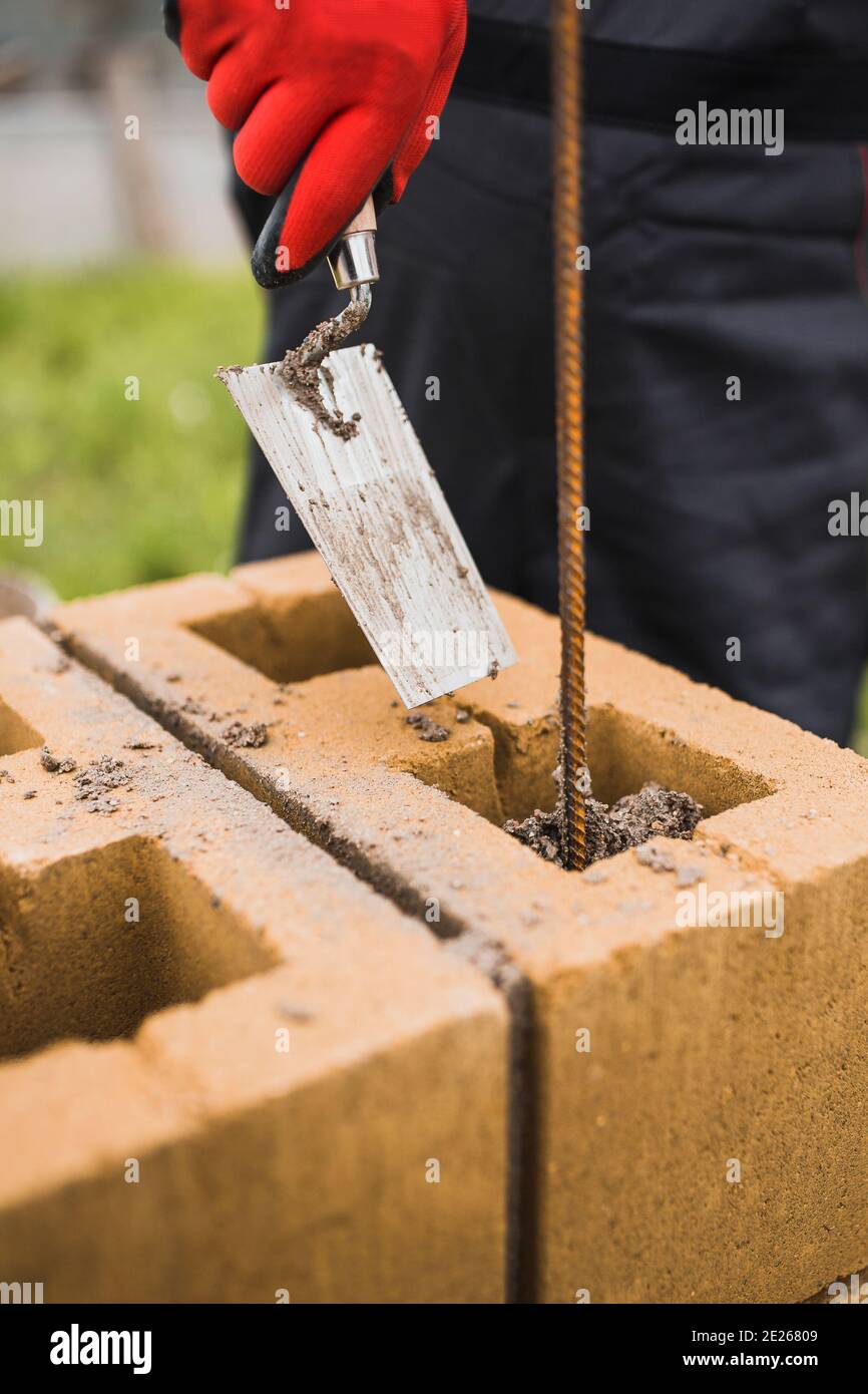Construction of a stone pillar from concrete blocks - supporting ...