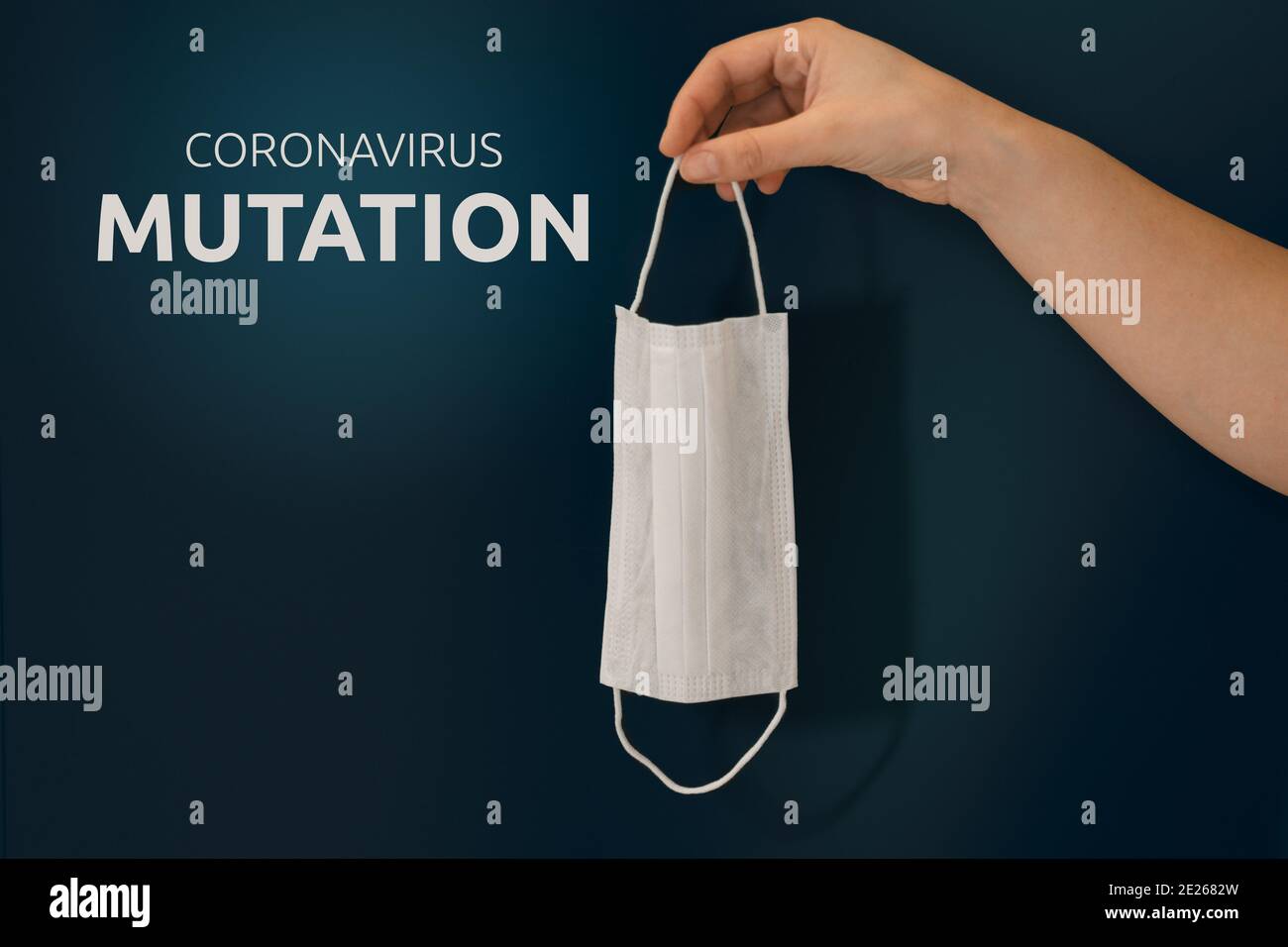 new mutation. mutated. text. holding a medical mask in hand. black ...