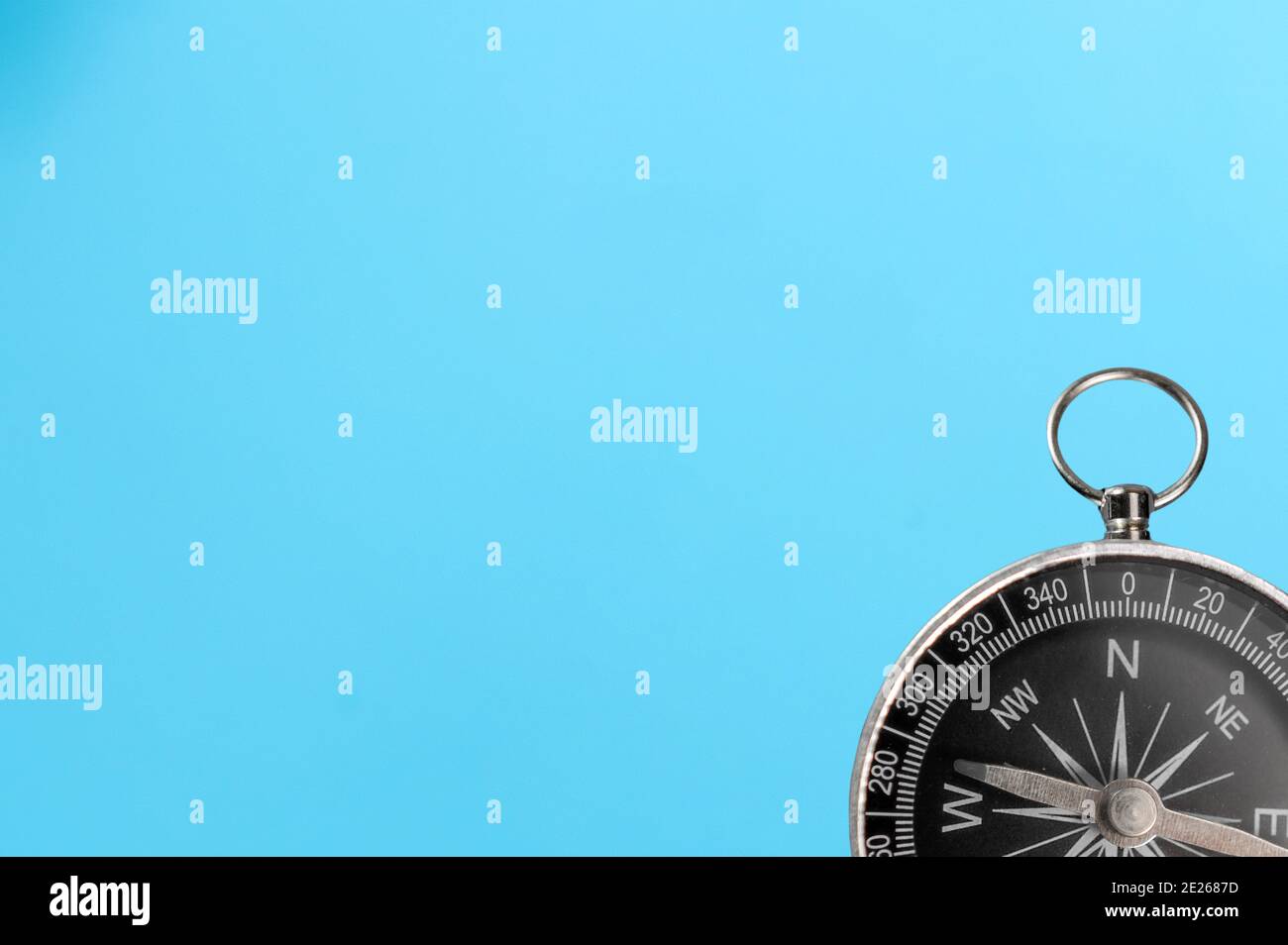 Compass isolated on a blue background. Direction concept Stock Photo ...