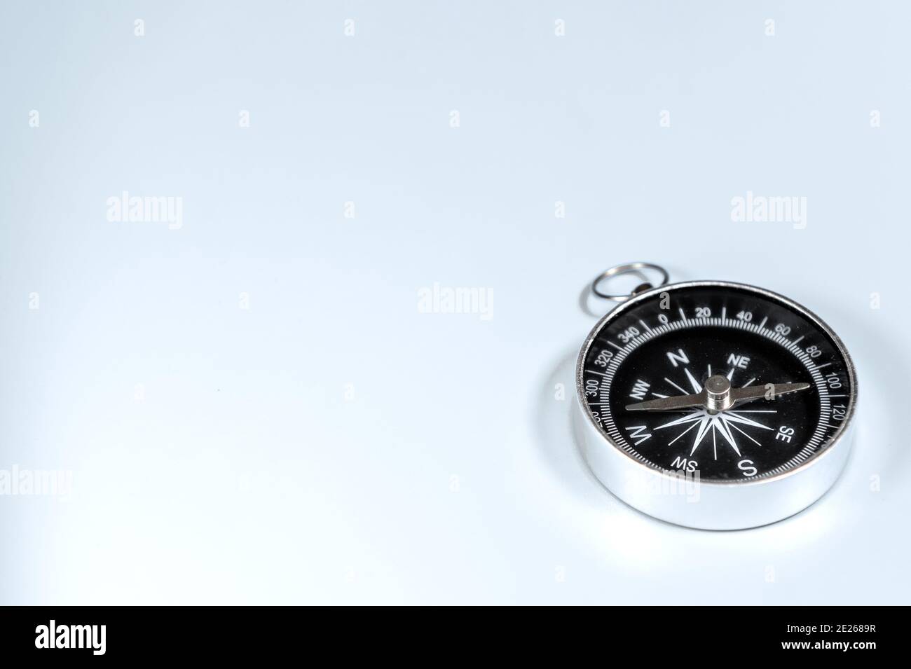 Compass close-up isolated on light background. Direction concept Stock ...