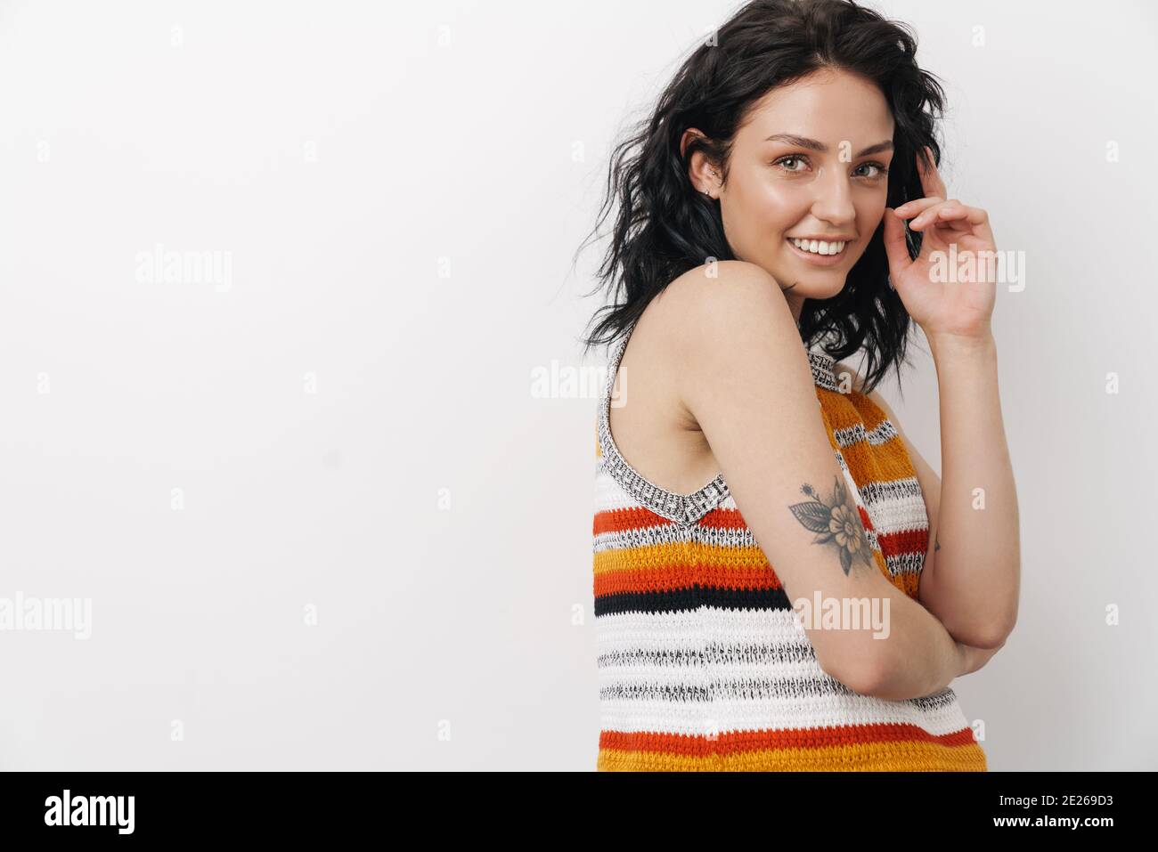 Pretty young positive cheery woman isolated over white wall background ...